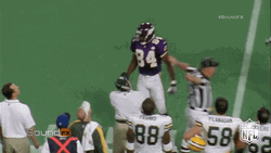 Playful Randy Moss Flexing Muscles GIF | GIFDB.com