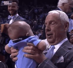 Roy Williams Holding The Baby GIF | GIFDB.com