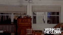 Scary Movie Clown Standing In The Window GIF | GIFDB.com