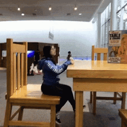 Short Girl Seating In A Huge Chair GIF | GIFDB.com