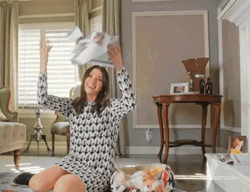 Smiling Then Throwing Papers GIF | GIFDB.com