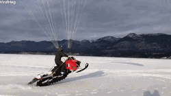 Snowmobile Running With A Parachute GIF | GIFDB.com