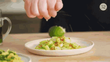 Squeezing Juicy Lime To Salad GIF | GIFDB.com