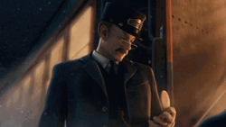The Polar Express Conductor Checks Clock GIF | GIFDB.com