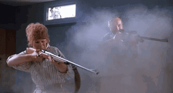 Tremors Heather And Burt Gummer Firing On Graboids GIF | GIFDB.com