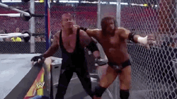 Triple H Slamming Opponent On Cage GIF | GIFDB.com