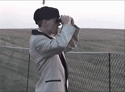 Watching The Area Using Binoculars GIF | GIFDB.com