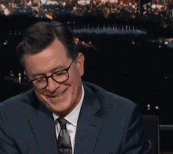 Were Waiting Stephen Colbert Tapping His Watch GIF | GIFDB.com