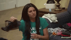 Woman Folding Clothes With Side Eye Meme GIF | GIFDB.com